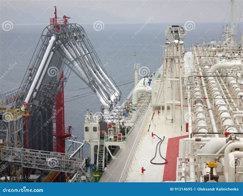 Lng Loading Arms For Load Discharge Lng Cargo Of Liquefied Natural Gas Tanker Royalty Free Stock