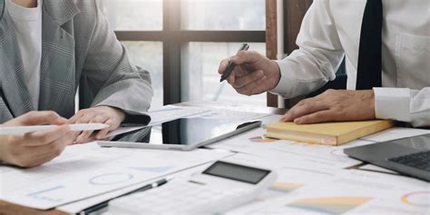 Group Of Business People Brainstorming Analyzing And Planning To Work