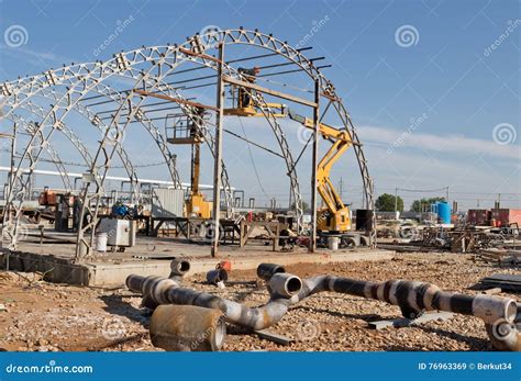 Elements Of The Pipeline Are At A Construction Site On The Background Of The Process Of Assembly