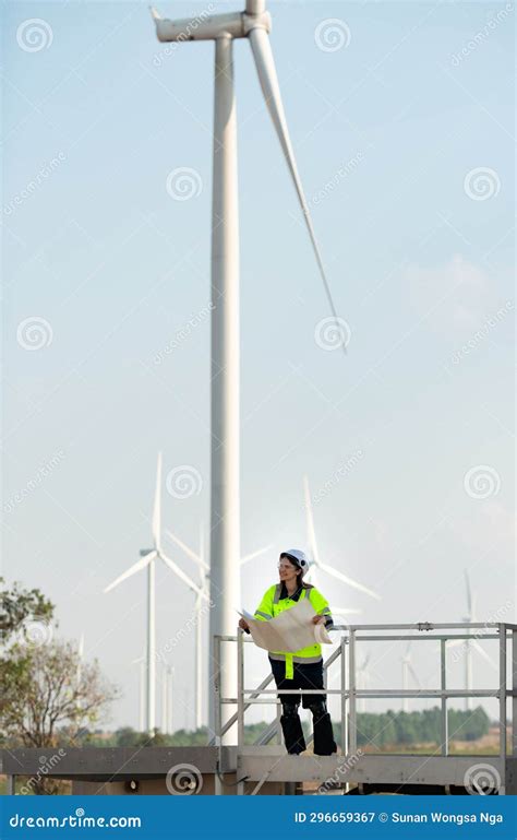 Portrait Of Female Engineer At Natural Energy Wind Turbine Site With The Mission Of Being