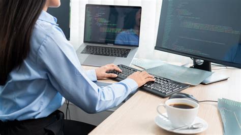 Asian Woman Programmer Typing Source Code With Computer Pc For Developing Program Or Application