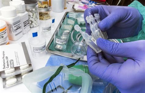 Nurse Refilling Medication Solution Nebulizer Container In The Hospital