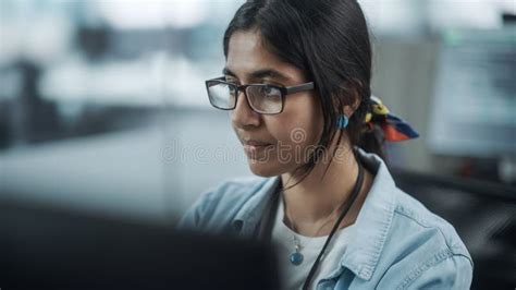 Diverse Office Portrait Of Confident Indian It Programmer Working On