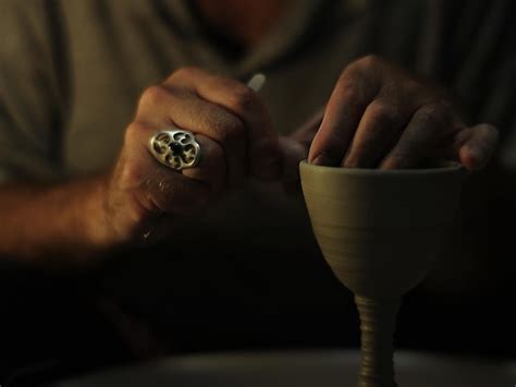 Premium Photo Midsection Of Man Making Clay Container In Workshop