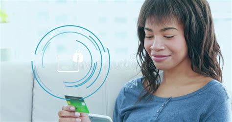 Animation Of Folder Icon And Data Over African American Woman Paying Online With Card Stock