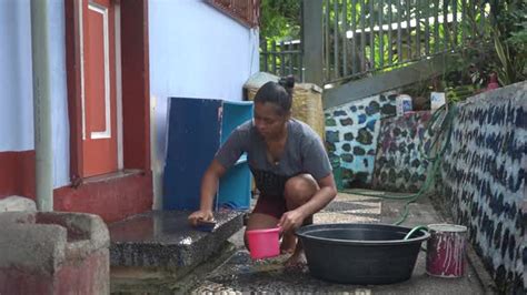 Lady Doing Household Chores And Brushing The Floor At The Orphanage