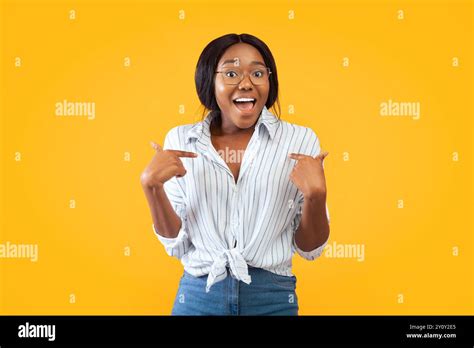 Black Girl Pointing Fingers At Herself Smiling Standing Studio Shot