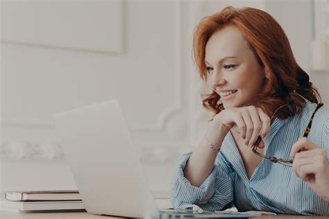 Premium Photo Horizontal Shot Of Redhead European Woman Poses At Home