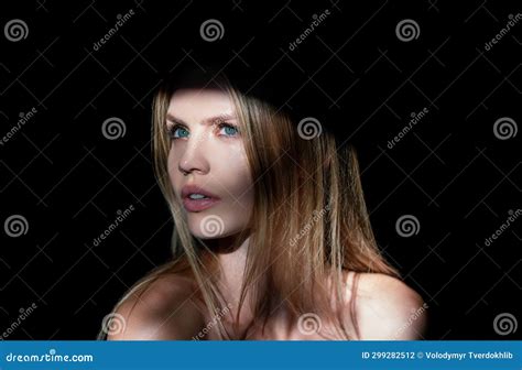 Sensual Woman With Light On A Black Background Beautiful Female Face In The Darkness Stock