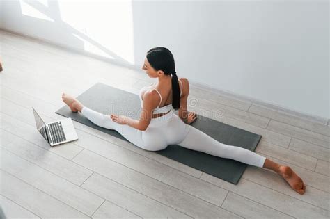With Laptop Young Caucasian Woman With Slim Body Shape Is Indoors At Daytime Stock Image