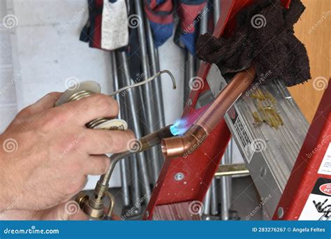 Hands Soldering Copper Pipes Together With Torch Stock Image Image Of Maintenance Hands