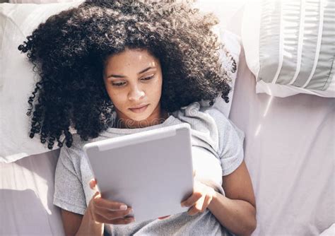 Black Woman Tablet And Top View In Bed In Bedroom For Social Media Texting Or Internet