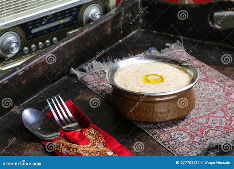 Hareesa Or Harees Arab Dish Served In Dish Isolated On Red Mat Top View