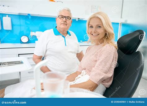 Smiling Woman During The Professional Dental Treatment In Stomatology