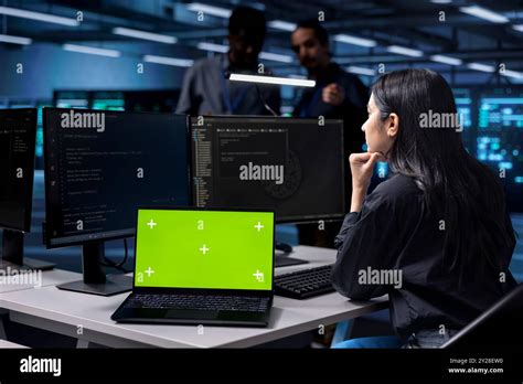 Woman Working On Laptop With Isolated Screen Monitor In Modern Data Center It Professional