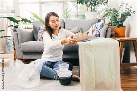 Asian Female Separate Garbage At Home Babe Woman Sorting And Recycling Plastic Paper