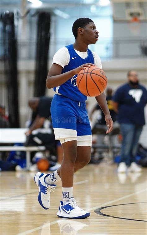Black Young Boy Holding And Ready To Pass The Ball Editorial Photo
