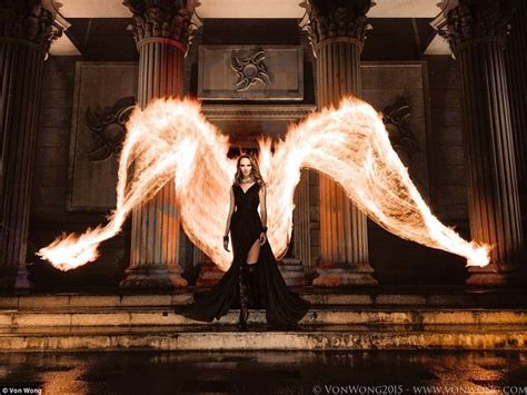 Photographer Snaps Model With Fiery Angel Wings On A Smartphone Light