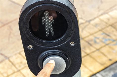 Premium Photo Cropped Hand Of Person Touching Push Button Of Traffic Light Control Box