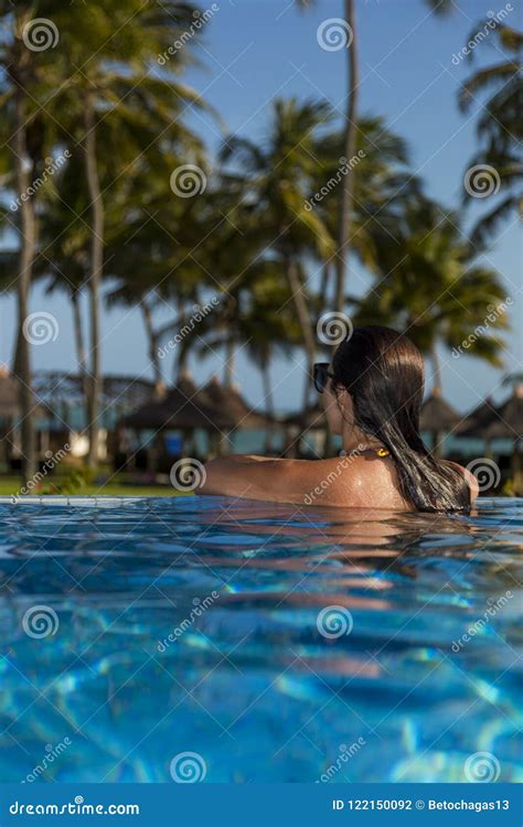 Beautiful Brazilian Woman Enjoying Vacation Holidays At A Pool Stock
