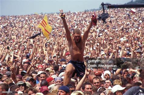 A Concert Fan Is Shown Rising Above The Crowd At Woodstock 99 In