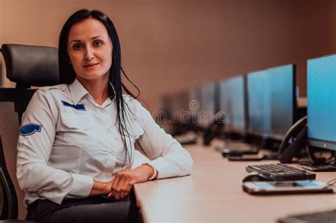 Female Security Operator Working In A Data System Control Room Offices Technical Operator