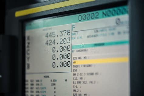 Cnc Machine Monitor Display With Program Code Running And Numbers Stock