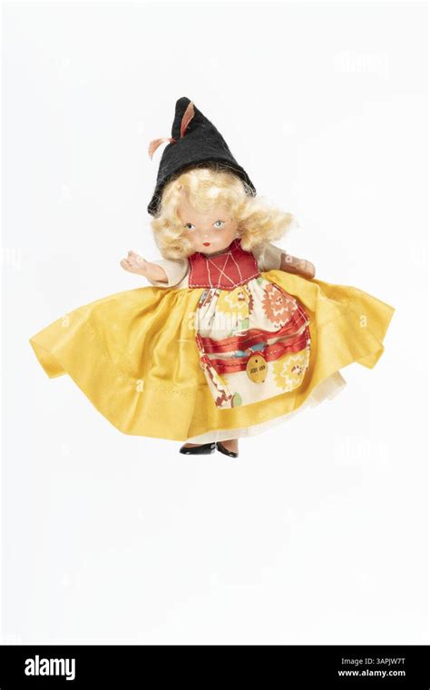A Bisque Girl Doll Dressed In Traditional Swedish Clothing Featuring A