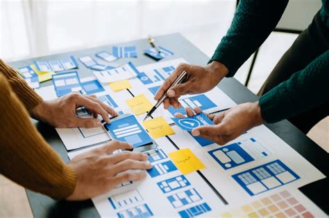 Ux Developer And Ui Designer Brainstorming About Mobile App Interface