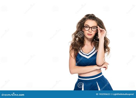 Serious Cheerleader Girl In Blue Uniform And Glasses Isolated On White