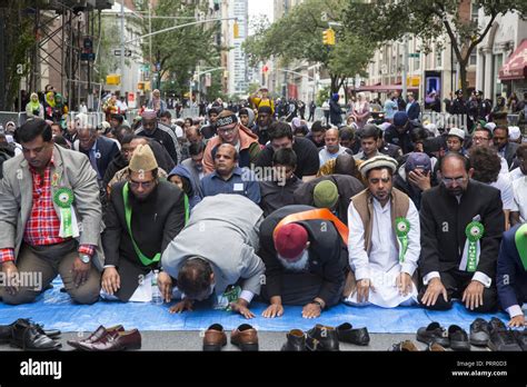 Diverse Group Of Muslim Men Pray On Madison Avenue Before The Annual