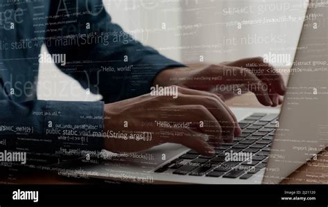 Computer Programmer Uses Capable Laptop Computer To Develop Programming Code Of New Software