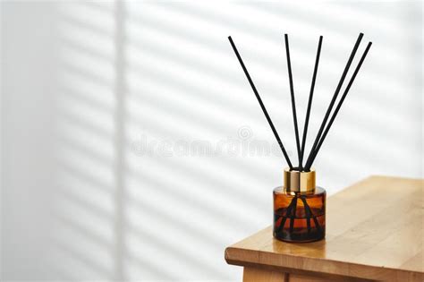 Elegant Reed Diffusers On Wooden Surface With Soft Background Light Stock Image Image Of Light
