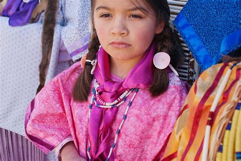 A Young Native American Girl In Traditional Clothing By Stocksy