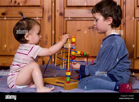 Babe And Brother Playing With Each Other Stock Photo Alamy