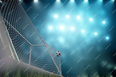 목표에 3d 렌더링 축구공입니다 스포트라이트와 경기장 조명 배경 성공 개념이 있는 그물에 축구공 잔디와 파란색 배경에 축구공입니다 프리미엄 사진