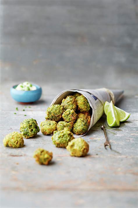Baked Spinach Balls In A Newspaper Cone Photograph By Meike Bergmann