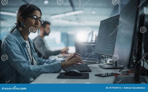 Diverse Office Indian It Programmer Working On Desktop Computer Female Specialist Creating