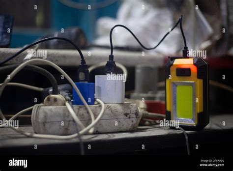 The Charger Is Plugged In Entangled Wires From Sockets Of Various Devices Chaos In Home Wired The Charger Is Plugged In Entangled Wires From Sockets Of Various Devices Chaos In Home Wired