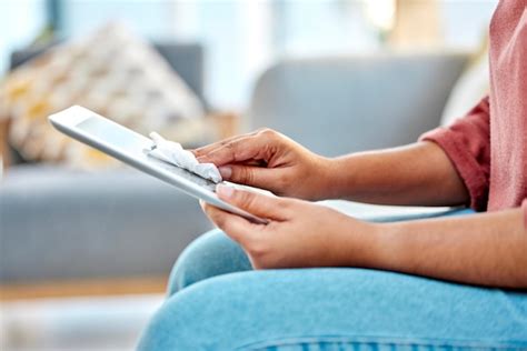 Premium Photo Woman Tablet And Wipe Screen For Dust Clean And Remove