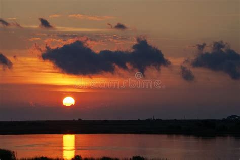 Rising Sun With Reflection Of The Sun Path In The Water Stock Image Image Of Orange Water