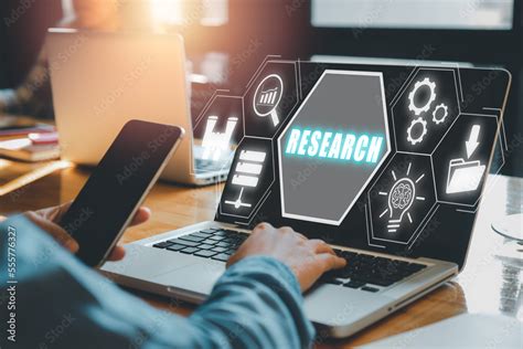 Research Concept Business Person Using Laptop Computer With Research Icon On Virtual Screen