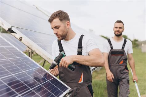Premium Photo Male Bearded Technician Installing Solar Panel Using