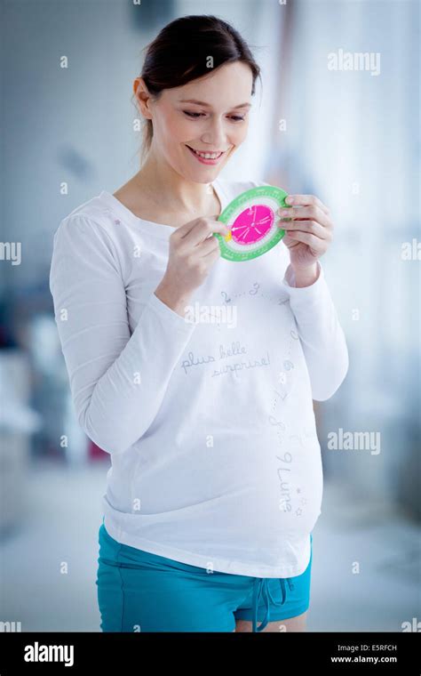 Woman Using A Conception Chart To Determine The Term Of Pregnancy Stock Photo Alamy
