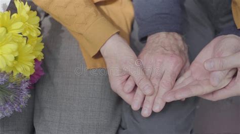 Closeup Hands Of An Old Woman Holding The Hand Of Old Man Hands Of Mature People Tender
