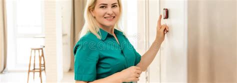 Smart Home Digital Thermostat Touch Screen Woman Touching Touchscreen To Adjust Temperature Of