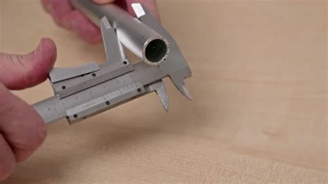 Man Measuring Aluminum Pipe With Caliper Stock Video Pond5