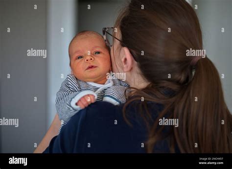 Portrait Of Mother Holding Newborn Baby Stock Photo Alamy