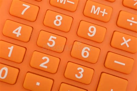A Close Up Of An Orange Calculator Highlighting The Numerical Keys And