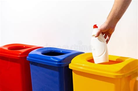 A Man Throws Garbage Into The Trash Can Close Up Photo Stock Image Image Of Pollution